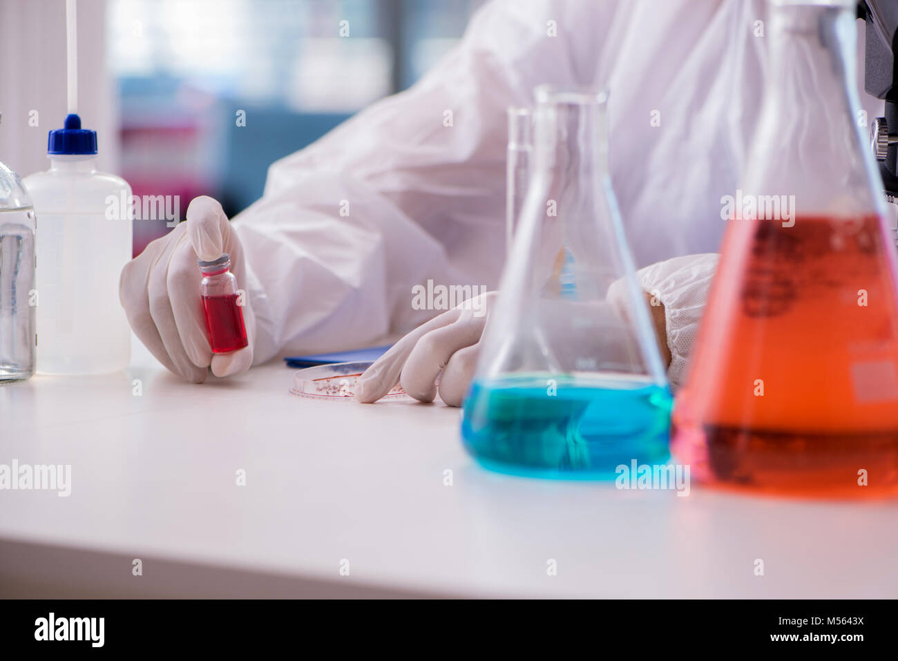 Chemist working in the laboratory with hazardous chemicals Stock Photo ...