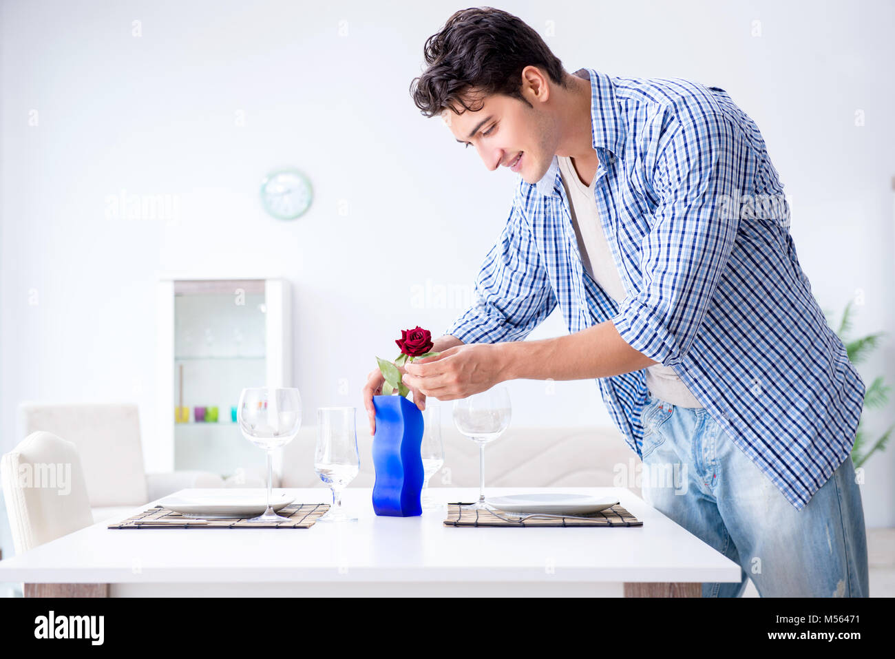 Man alone preparing for romantic date with his sweetheart Stock Photo ...