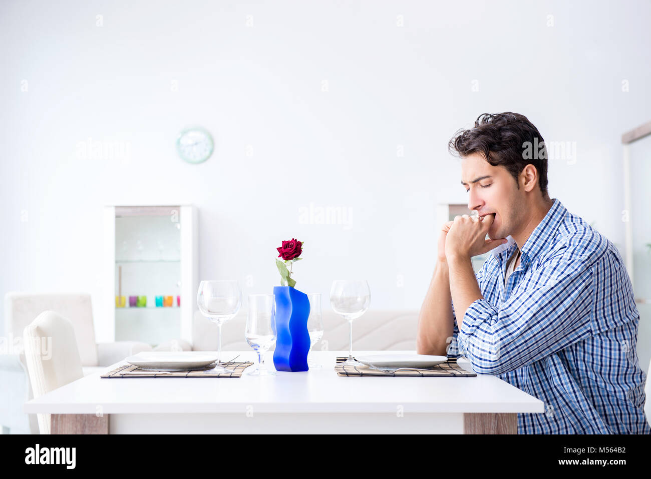 Man alone preparing for romantic date with his sweetheart Stock Photo ...