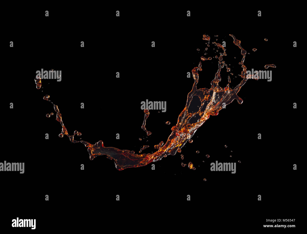 splash of ink isolated on black background. golden splash close-up ...