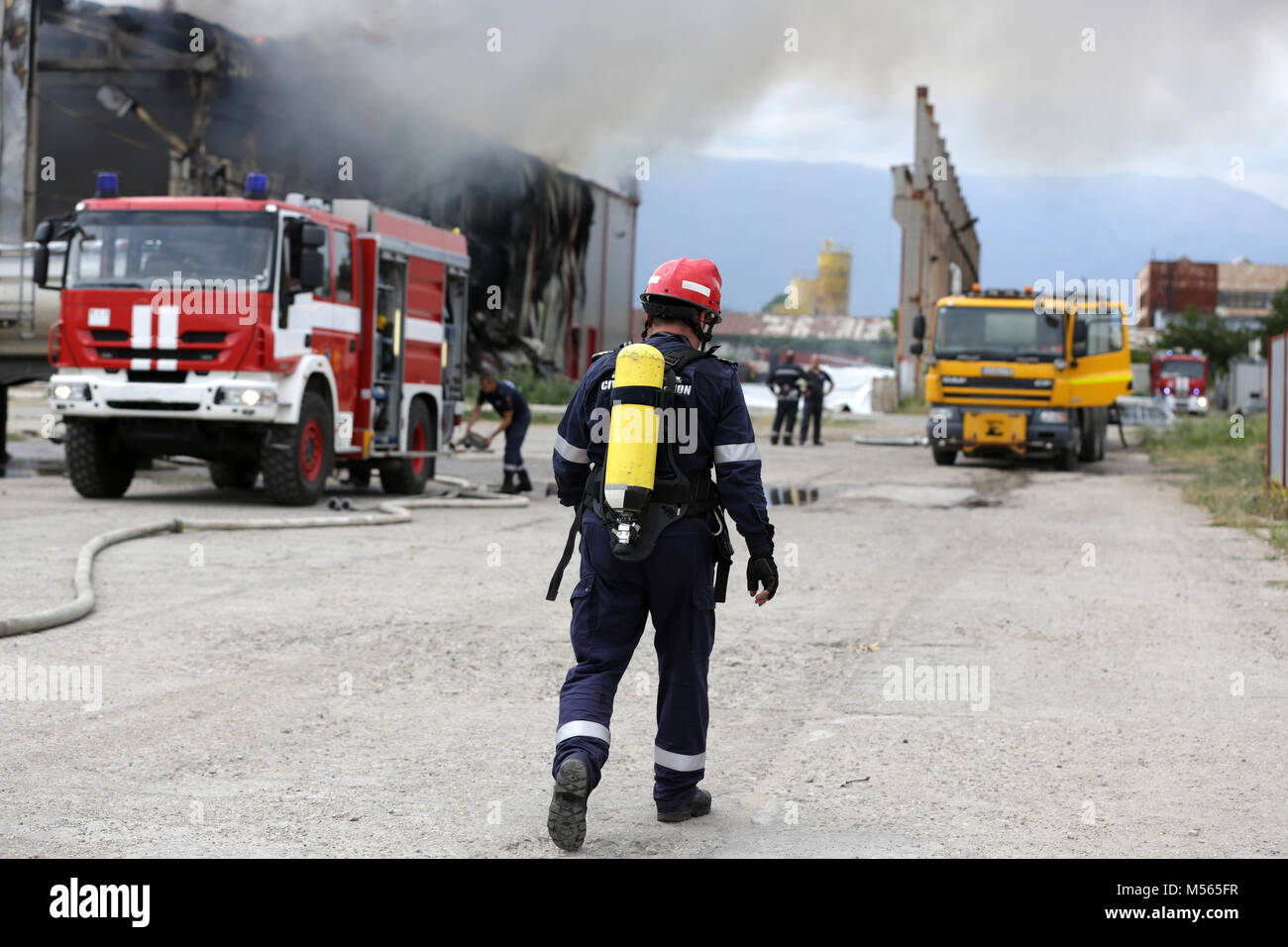 Large fire disaster in a warehouse Stock Photo - Alamy