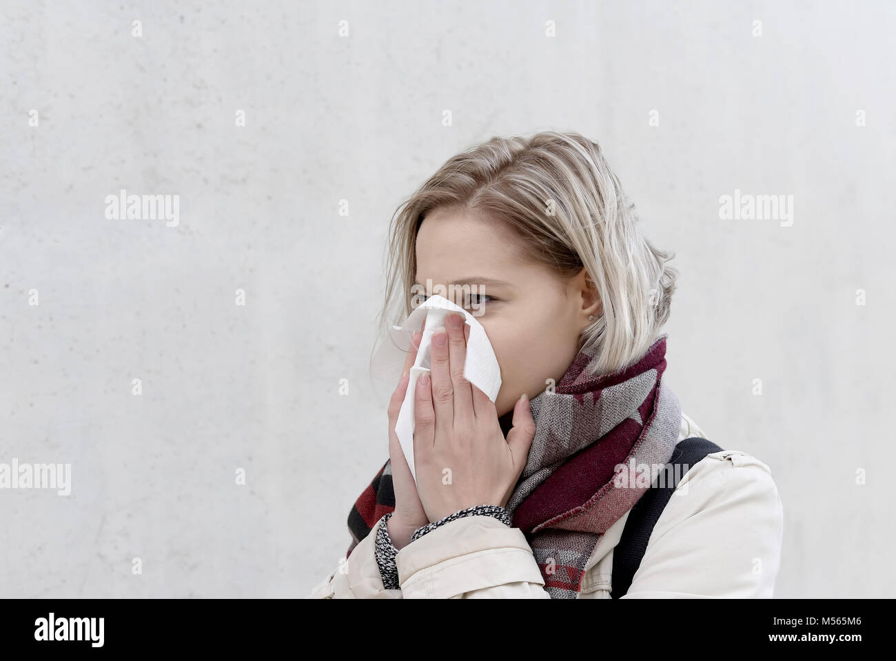 Woman sneezing handkerchief hi-res stock photography and images - Alamy