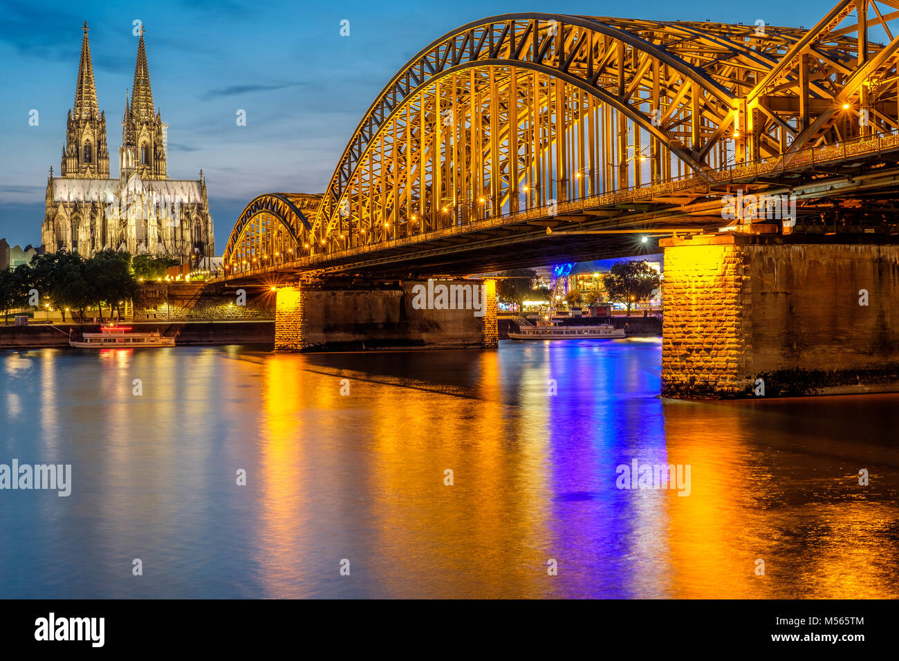 Cologne Cathedral and Hohenzollern Bridge at night, Germany Stock Photo ...
