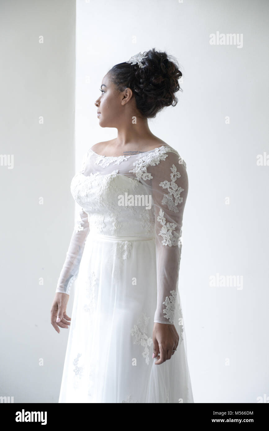 Portrait of a beautiful model wearing a white designer Wedding dress ...