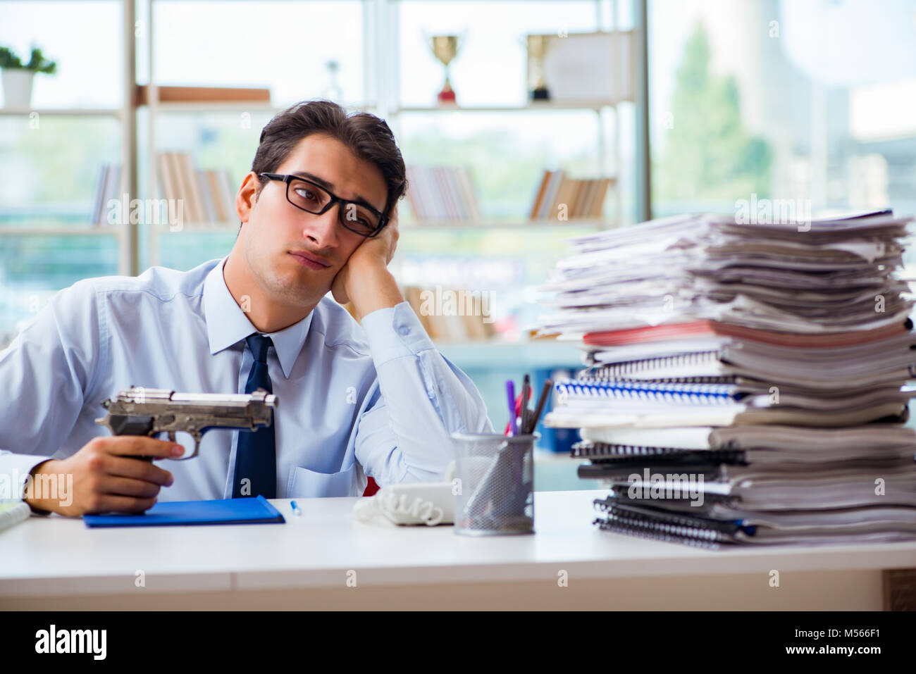 Angry businessman with gun thinking of committing suicide Stock Photo ...