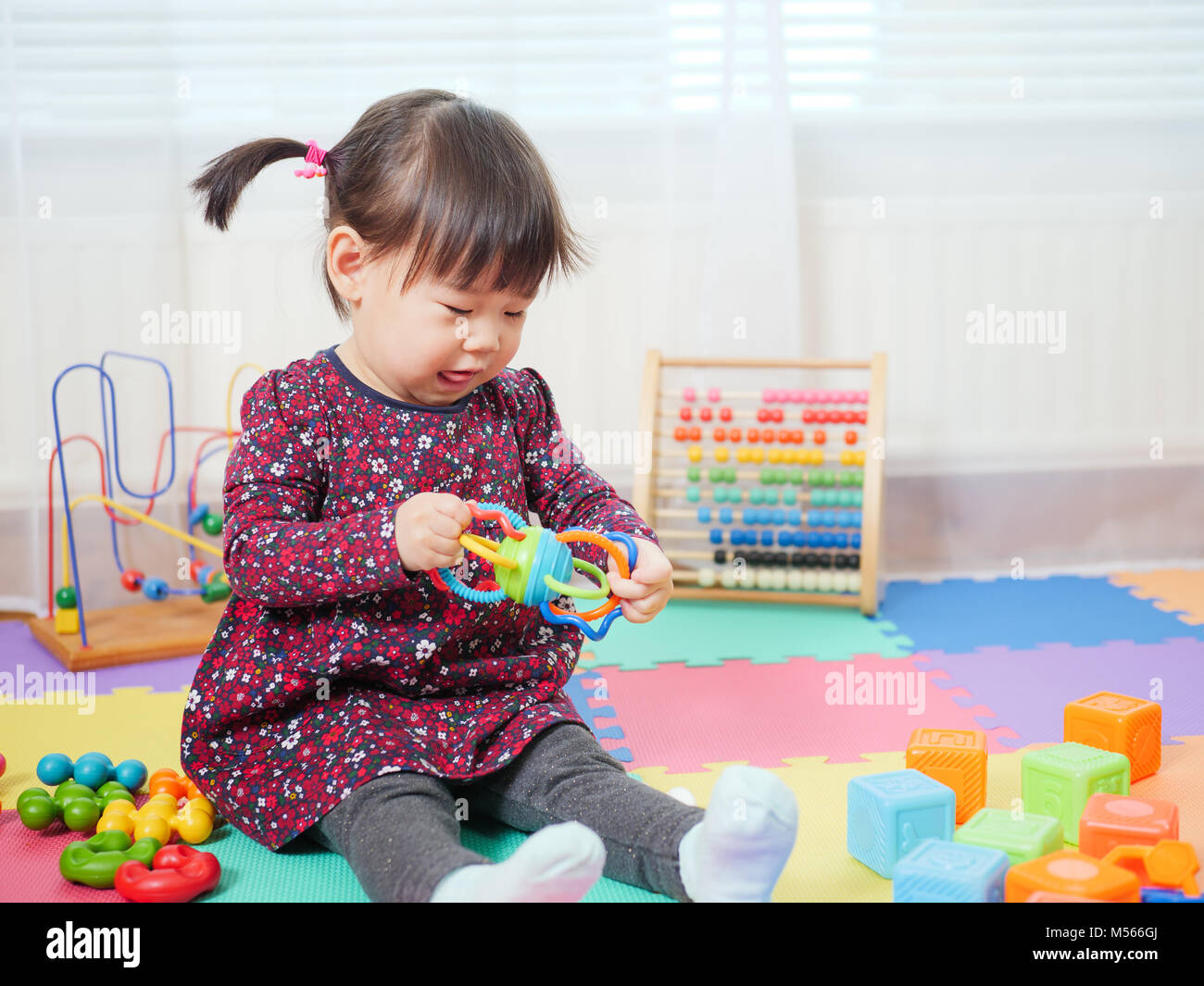 baby girl play toy at home Stock Photo - Alamy