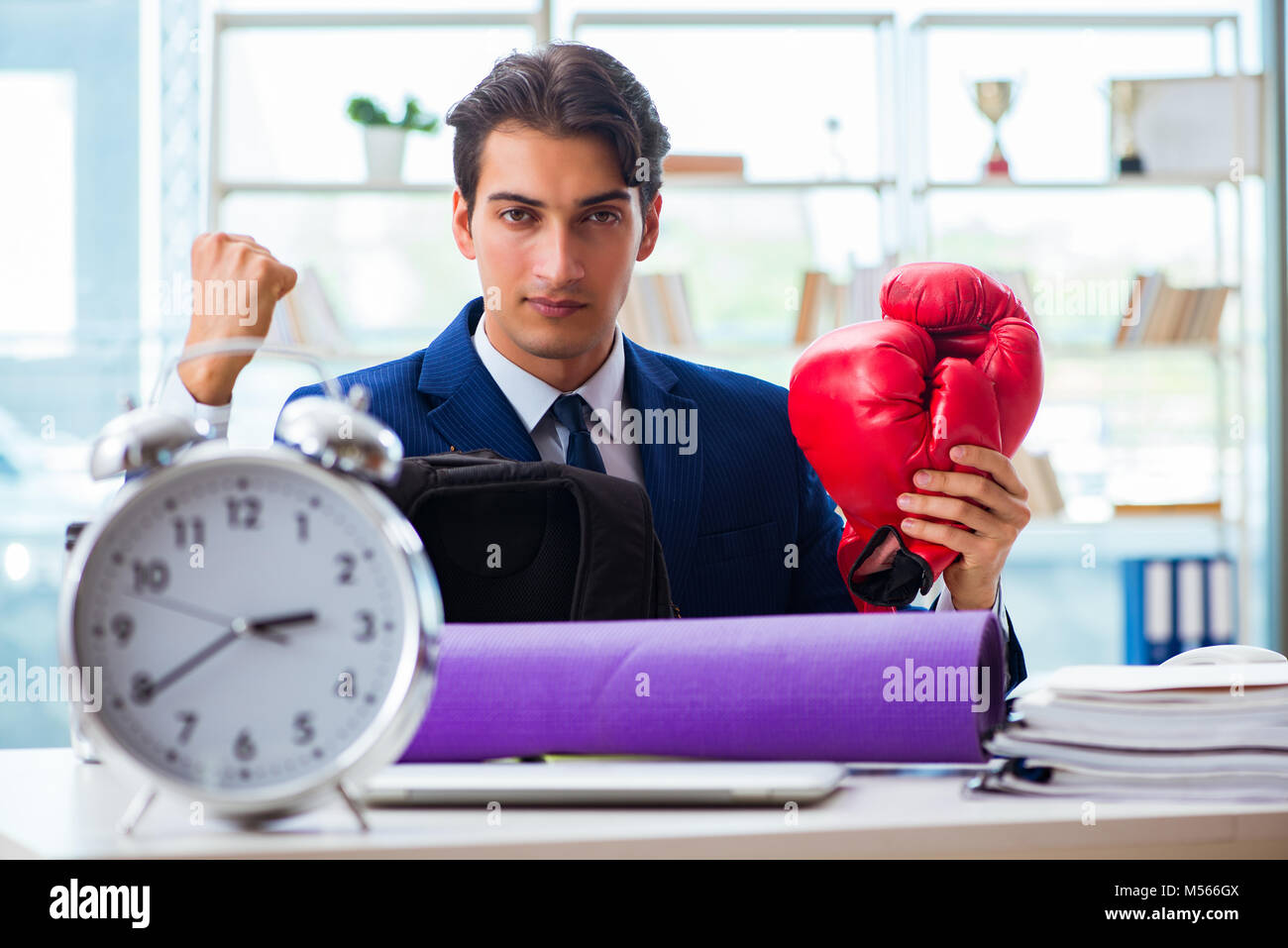Man with boxing gloves in the office Stock Photo - Alamy