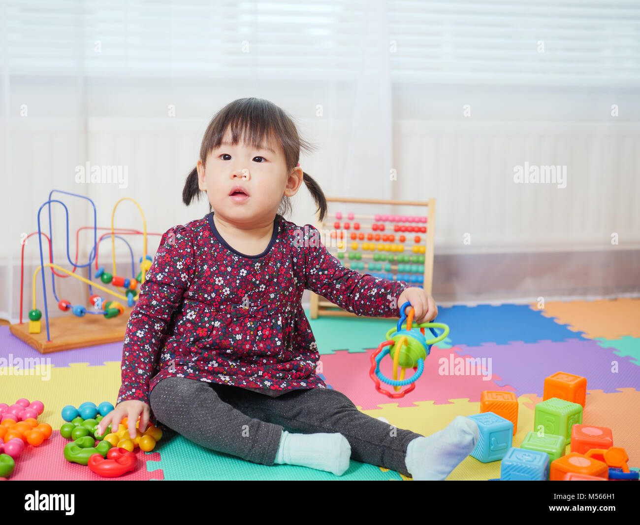 baby girl play toy at home Stock Photo - Alamy
