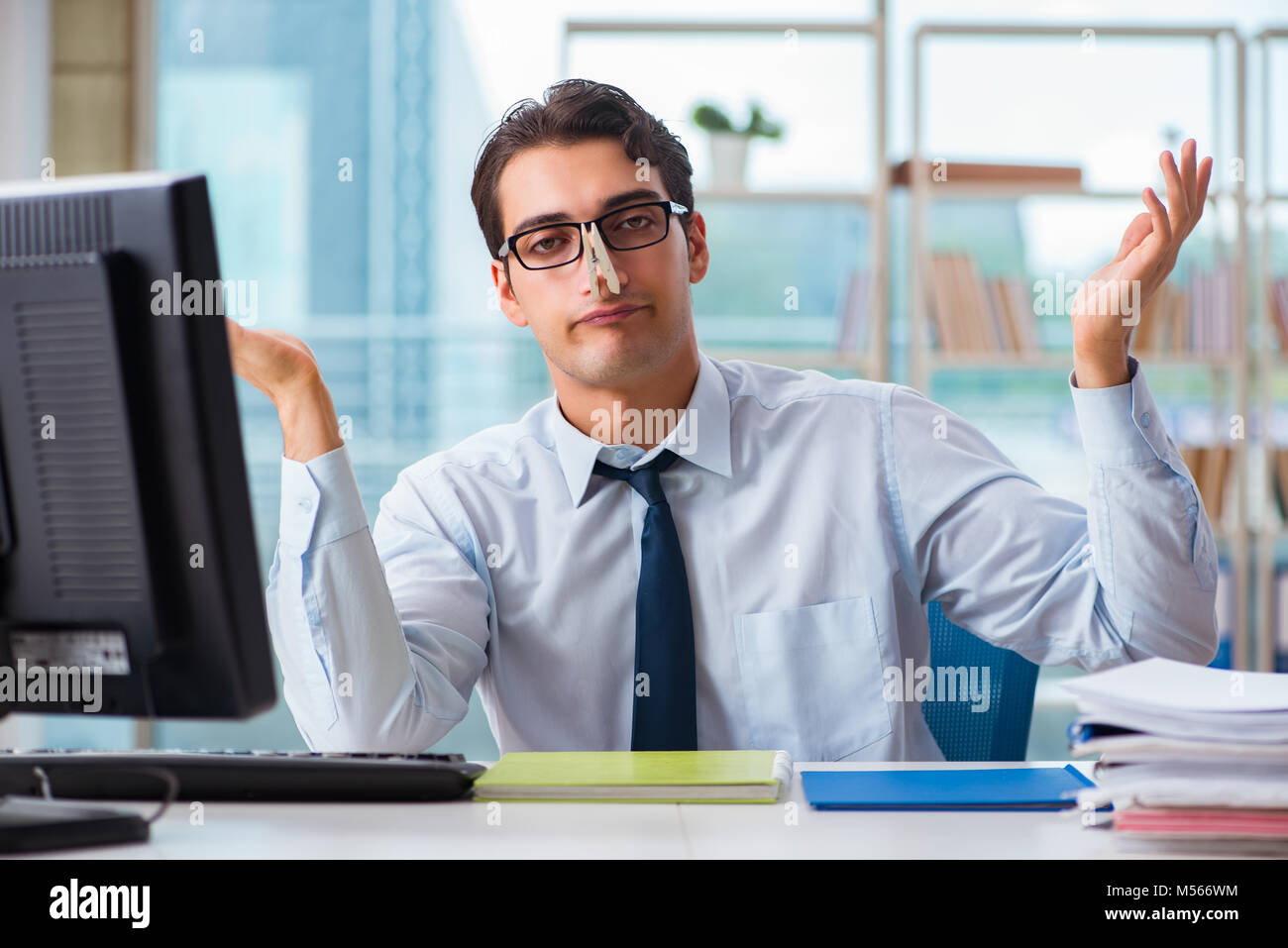 Businessman suffering from excessive armpit sweating Stock Photo - Alamy