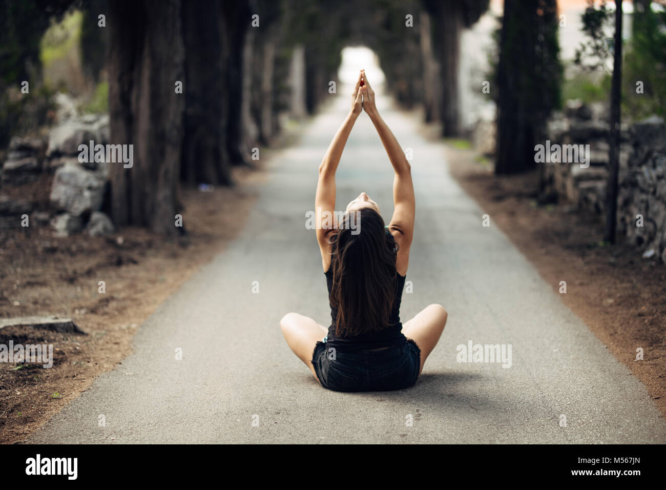 Carefree calm woman meditating in nature.Finding inner peace.Yoga ...