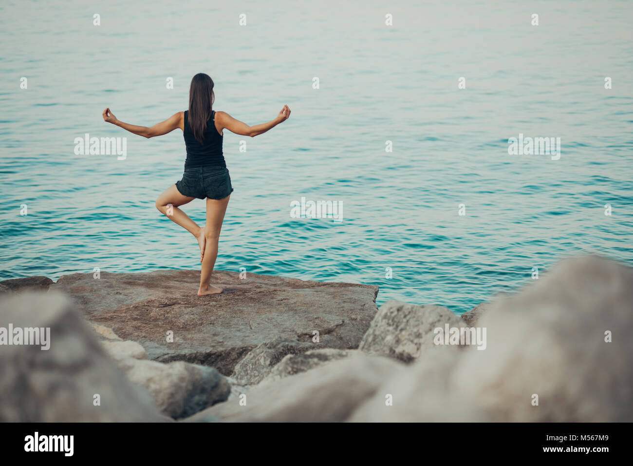 Carefree woman meditating in nature.Finding inner peace.Yoga practice ...