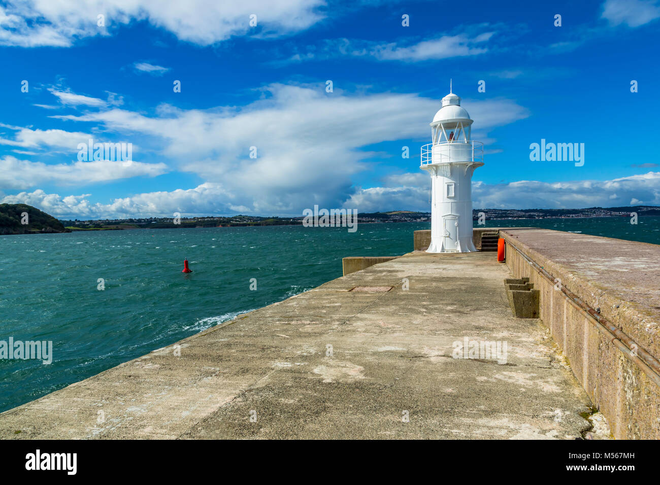 The lighthouse at the end of the harbour wall in Brixham, South Devon ...