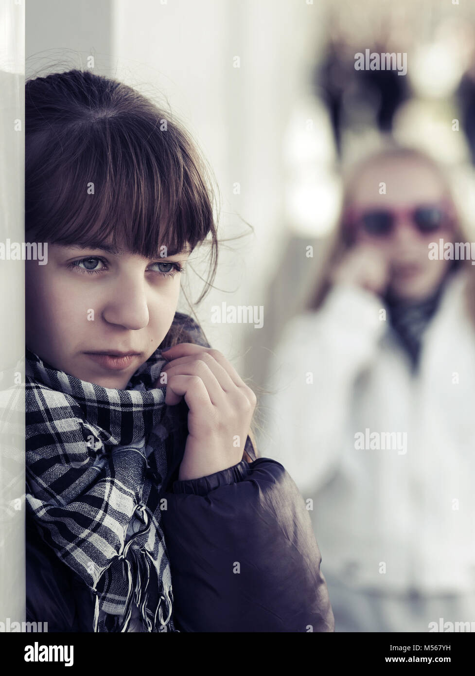 Teen girl in depression at the wall Stock Photo - Alamy