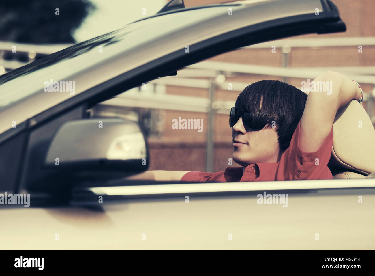 Cool guy driving convertible car hi-res stock photography and images ...