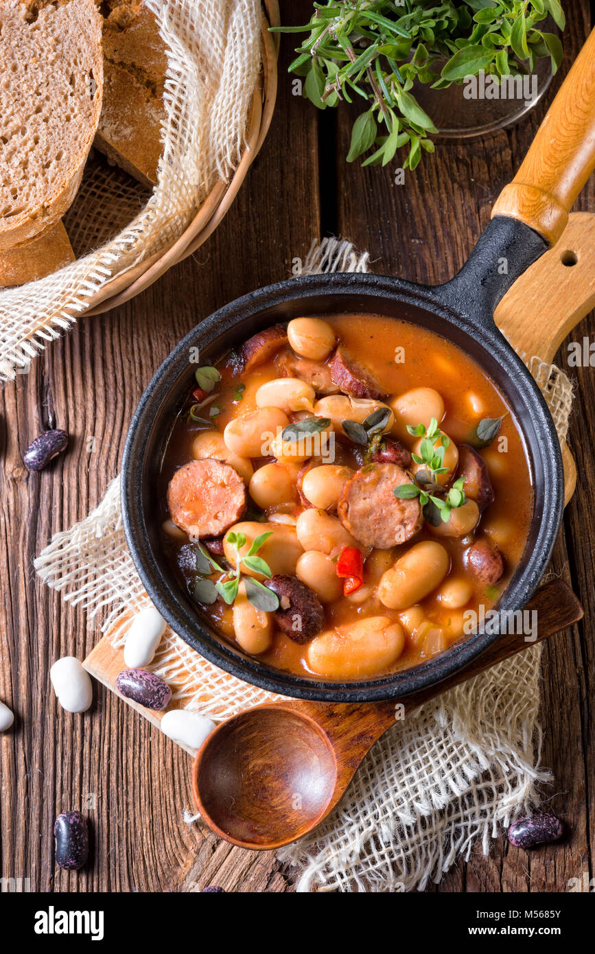 Polish Baked Beans with sausage Stock Photo - Alamy