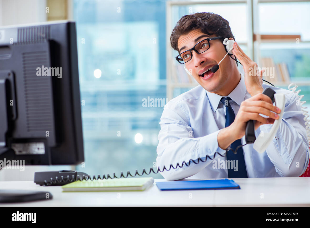 Unhappy angry call center worker frustrated with workload Stock Photo ...