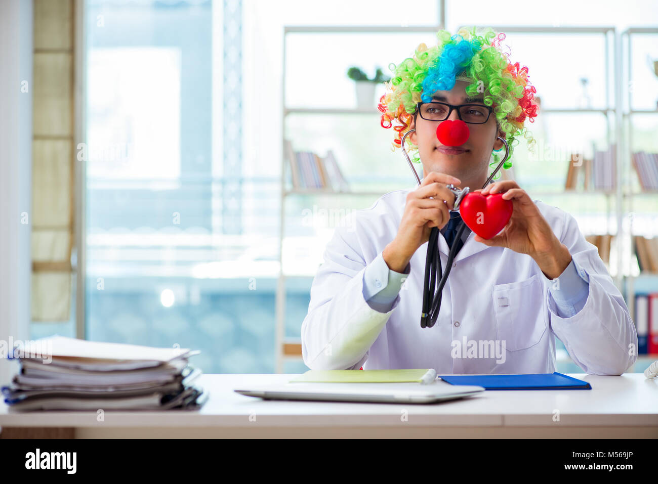 Child cardiologist with stethoscope and red heart Stock Photo - Alamy