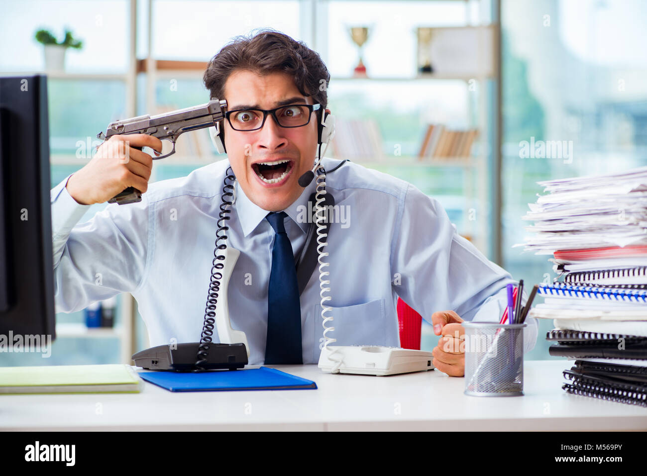 Unhappy angry call center worker frustrated with workload Stock Photo ...