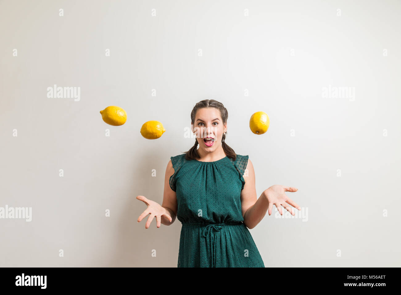 Screaming vegetarian and limon fruits flying around Stock Photo - Alamy
