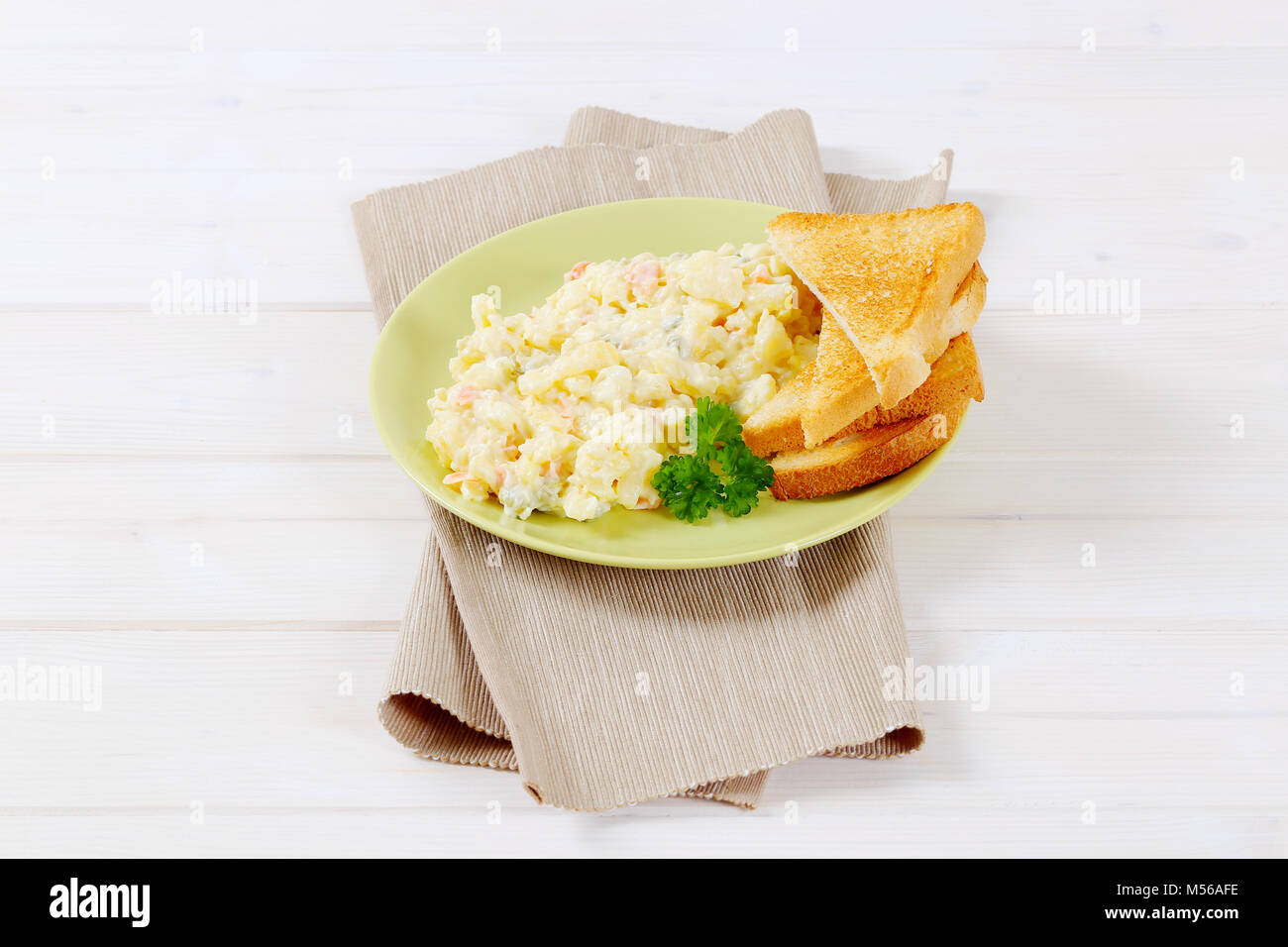 toast with potato salad on green plate Stock Photo - Alamy