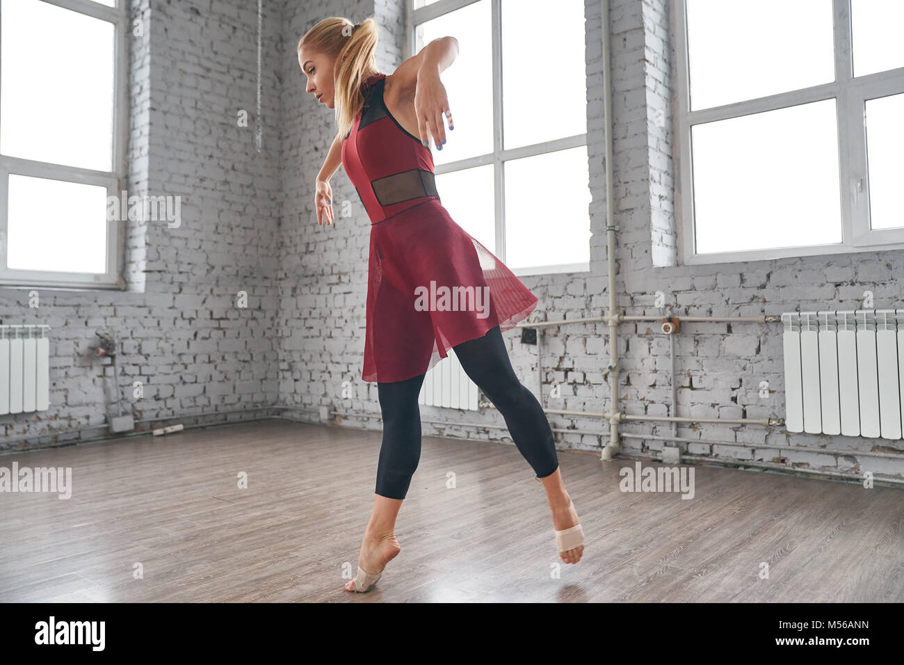 Young female dancer jumping and dancing in the gym Stock Photo - Alamy