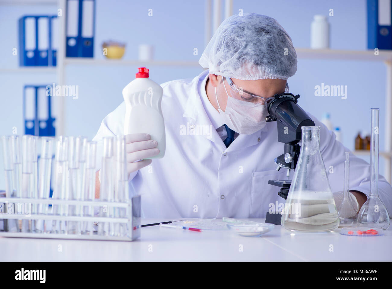 Man in the lab testing new cleaning solution detergent Stock Photo - Alamy