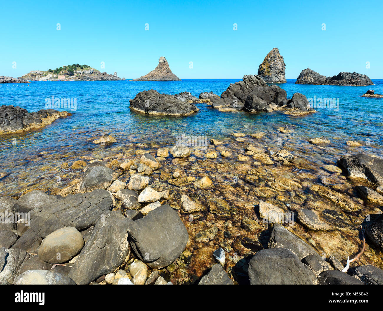 Aci Trezza Faraglioni, Sicily coast Stock Photo - Alamy