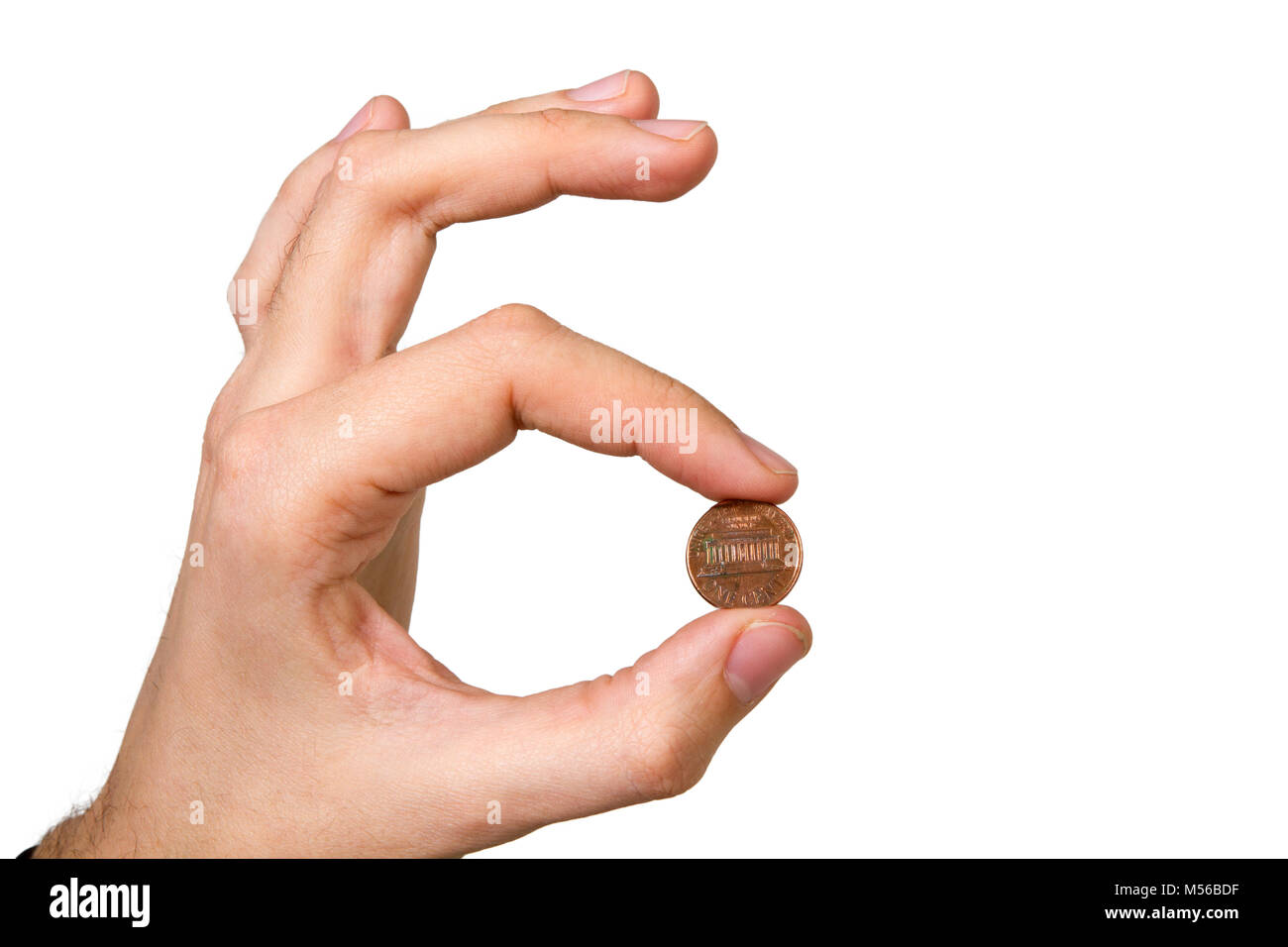 man's hand holding coin Stock Photo - Alamy
