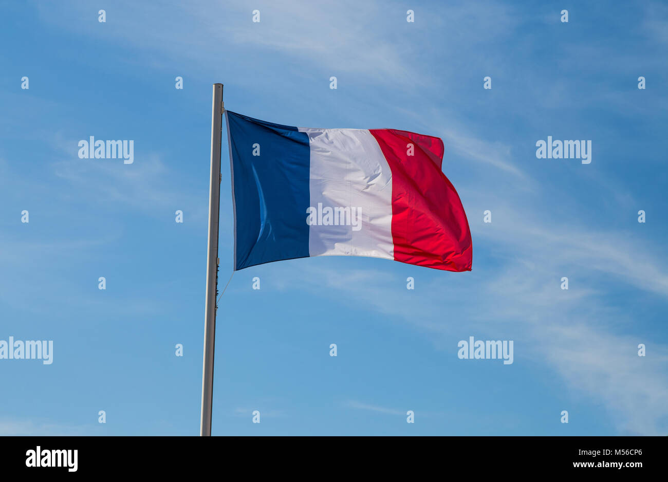 French flag under blue sky Stock Photo - Alamy