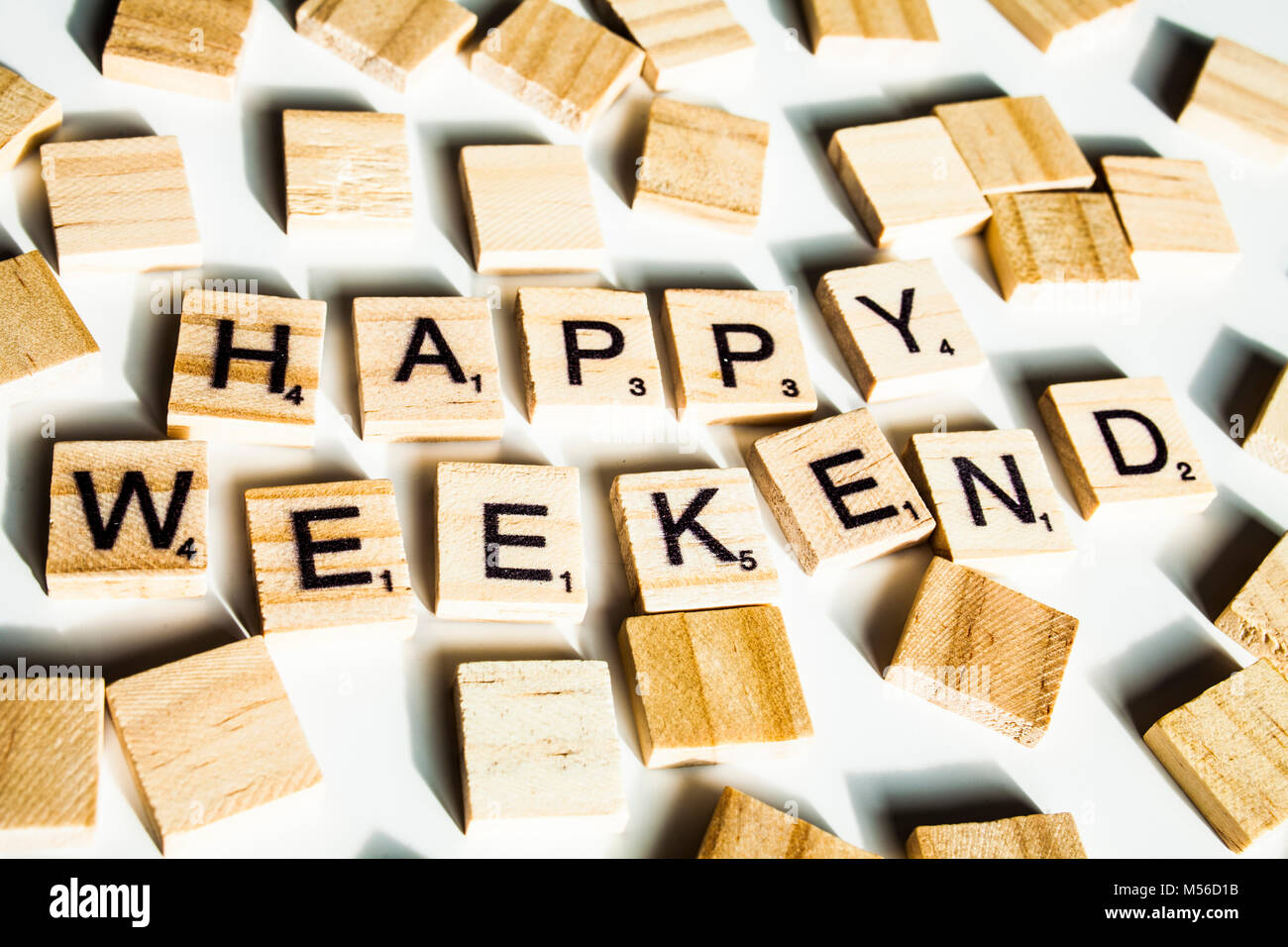 WORD HAPPY WEEKEND. Wooden letters spelling the word HAPPY WEEKEND on ...