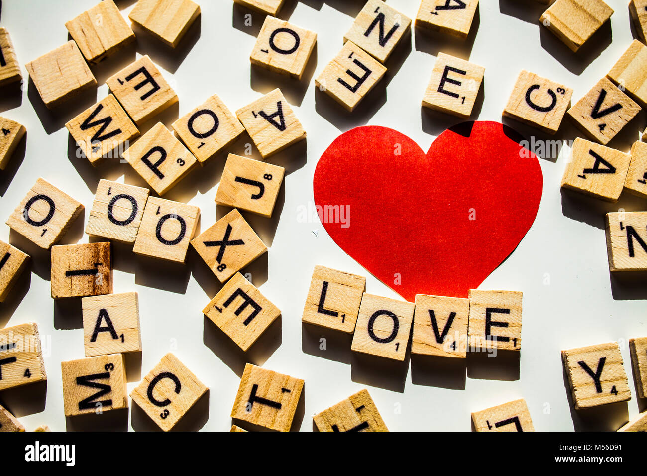 WORD LOVE. Wooden letters spelling the word LOVEon white background ...