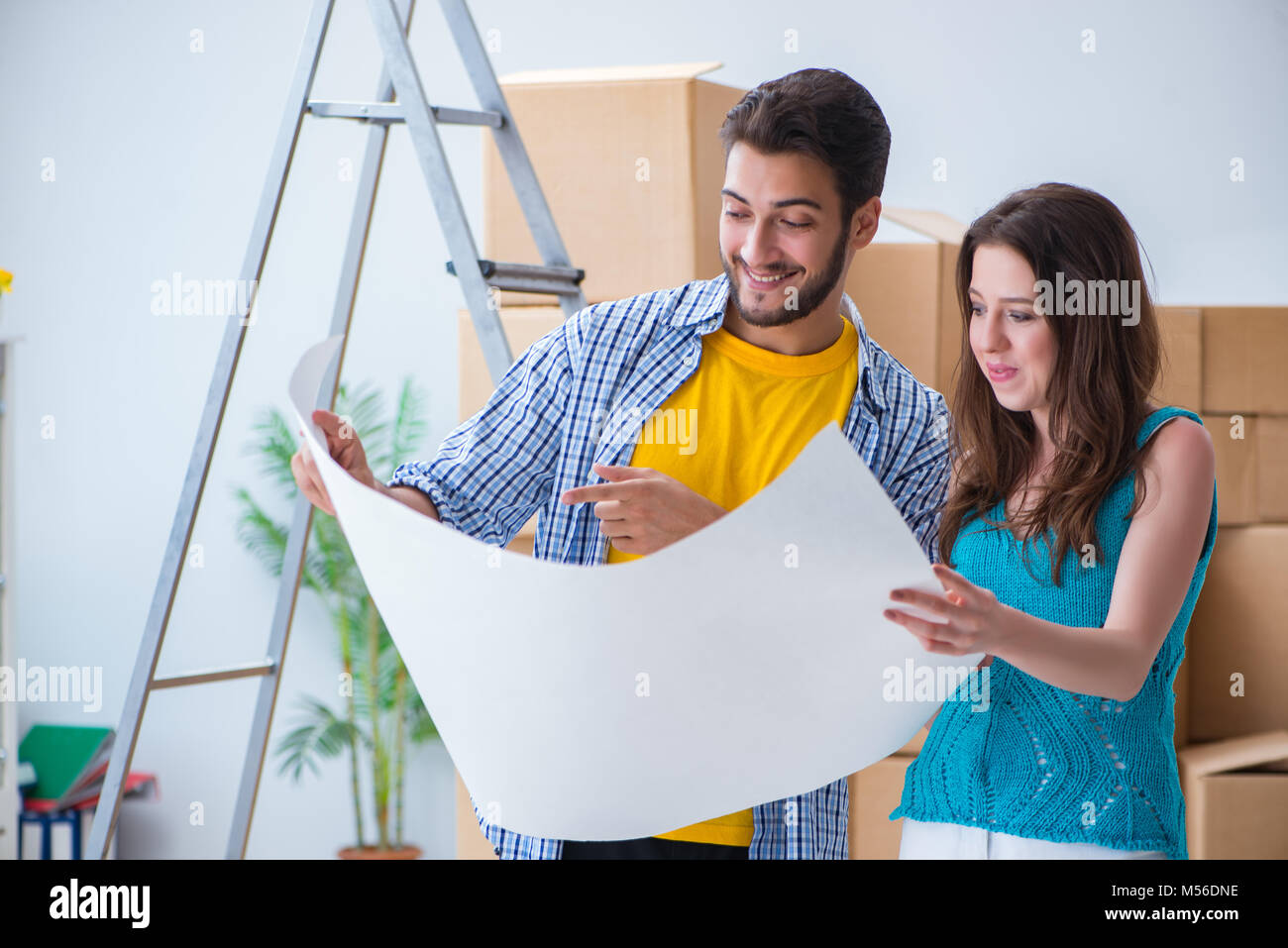 Young family planning home refurbishing in DIY concept Stock Photo - Alamy