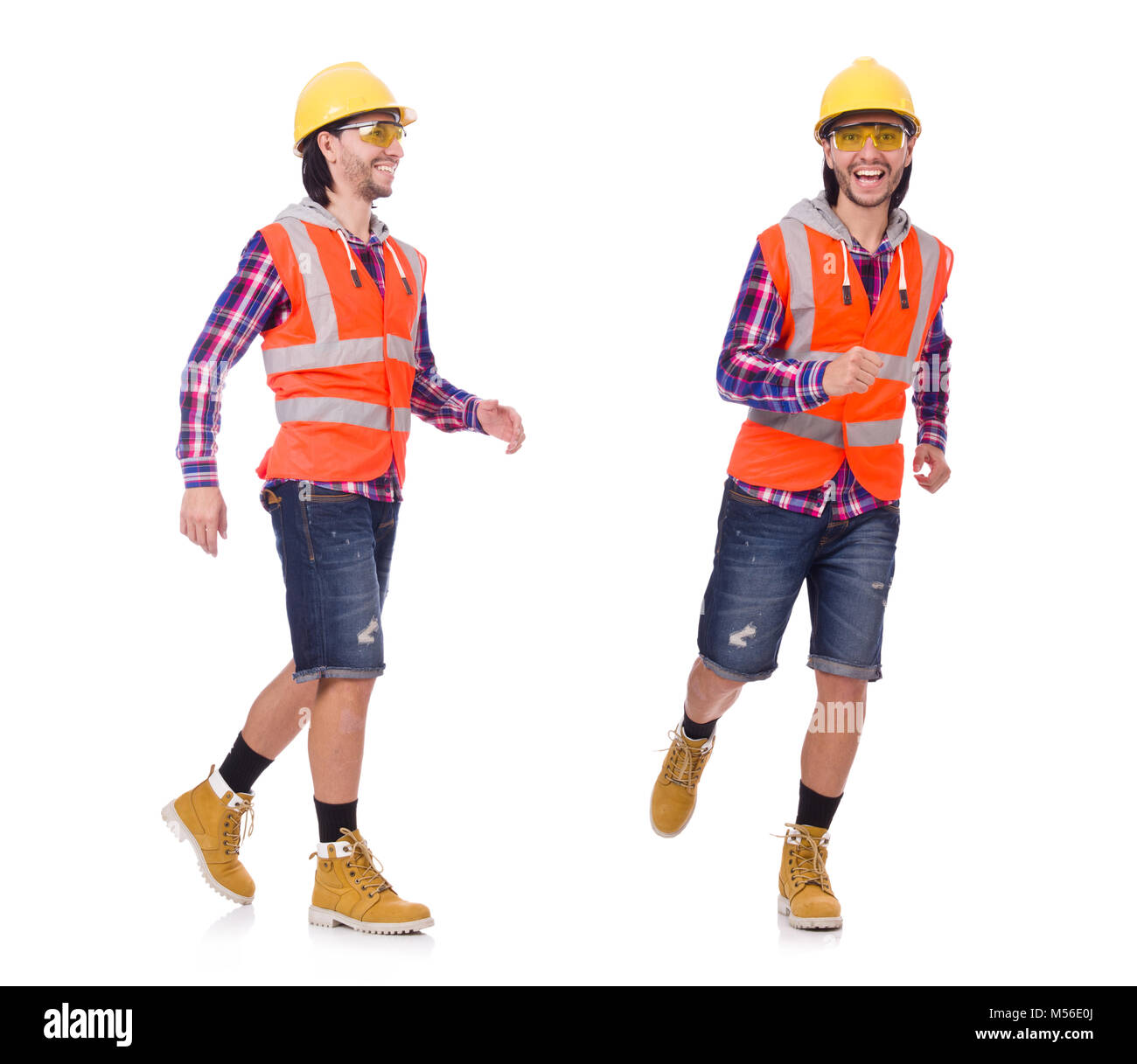 Walking young construction worker isolated on white Stock Photo - Alamy