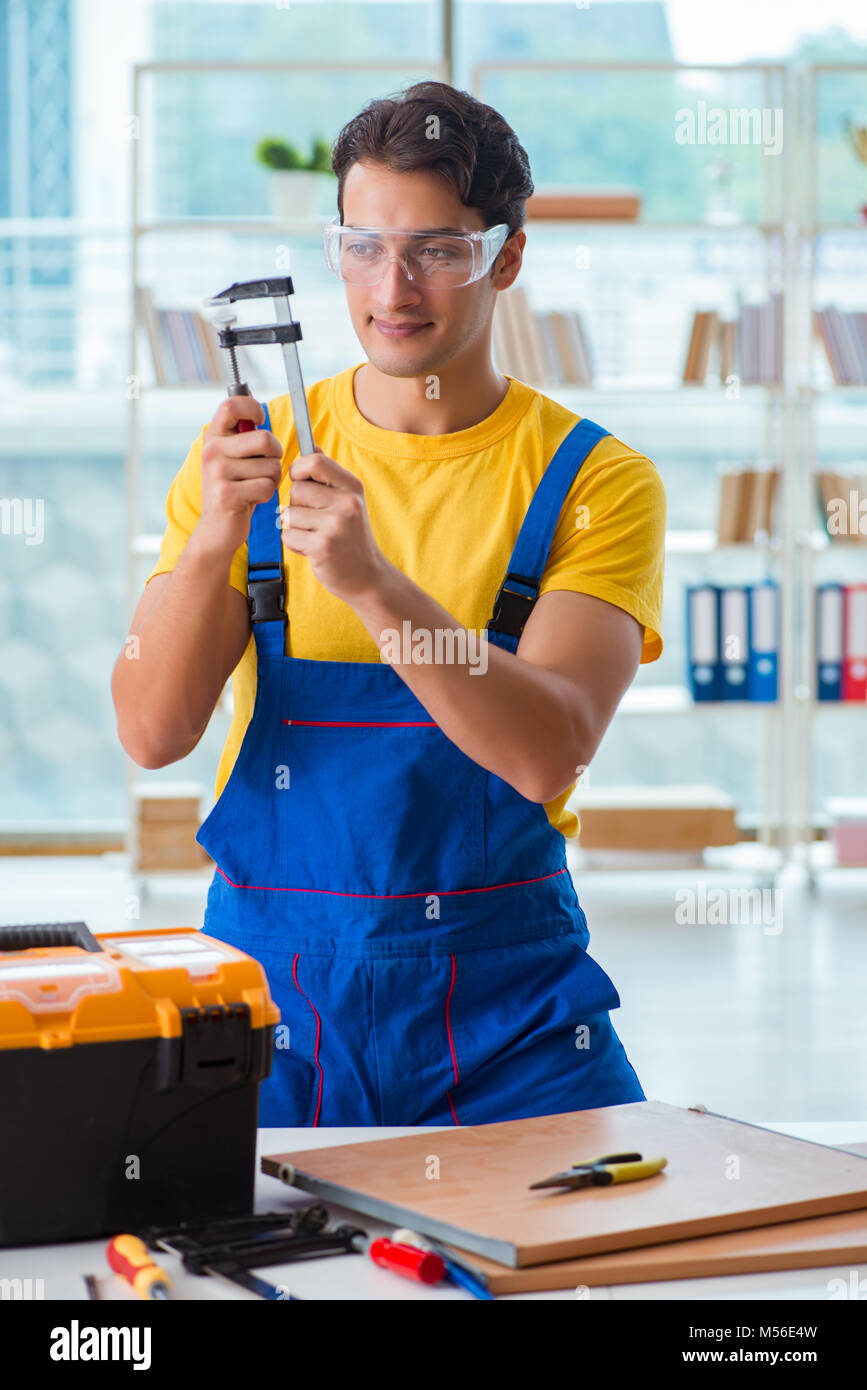 Furniture carpenter working in the workshop Stock Photo - Alamy