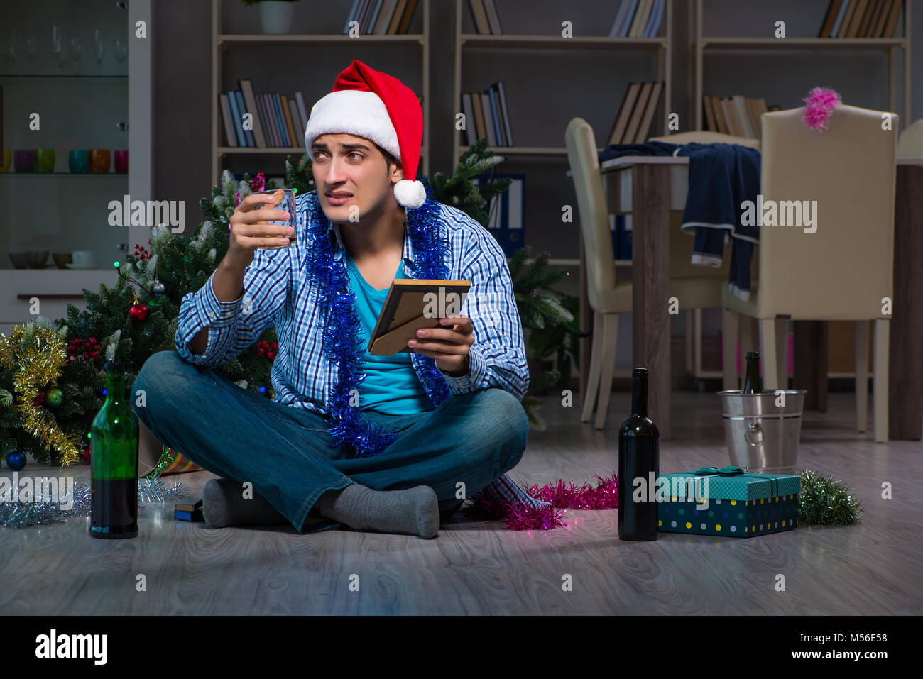 Man celebrating christmas at home alone Stock Photo - Alamy