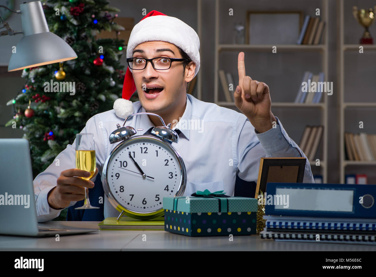 Businessman working late on christmas day in office Stock Photo - Alamy