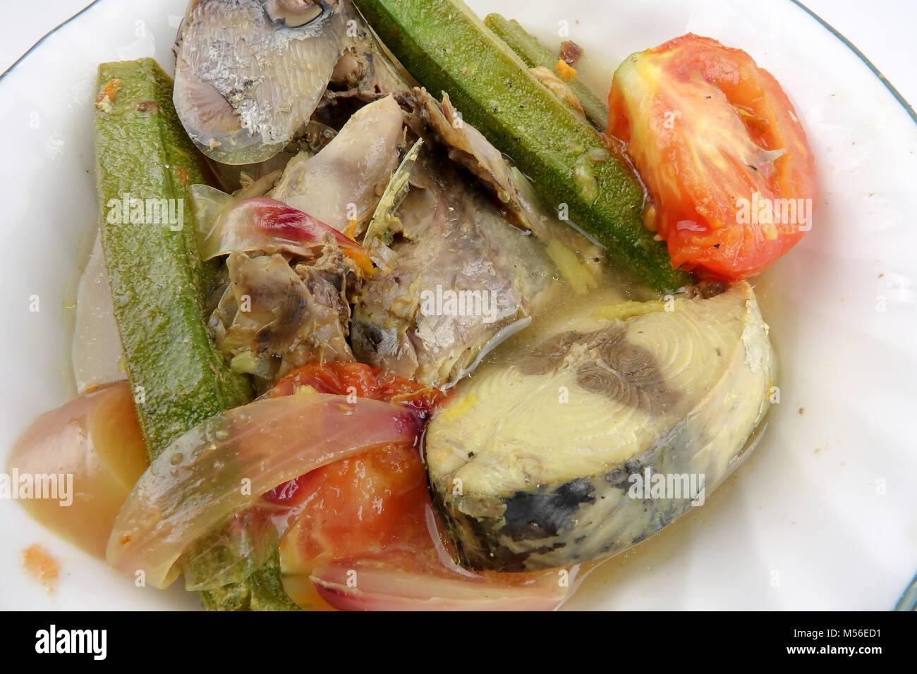 Thai Food of Tom Yum sea fish,tuna spicy soup in bowl on white ...