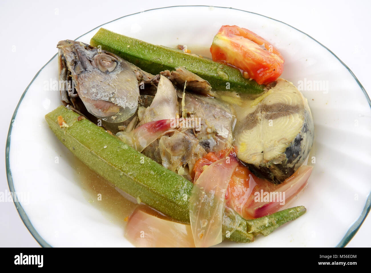 Thai Food of Tom Yum sea fish,tuna spicy soup in bowl on white ...