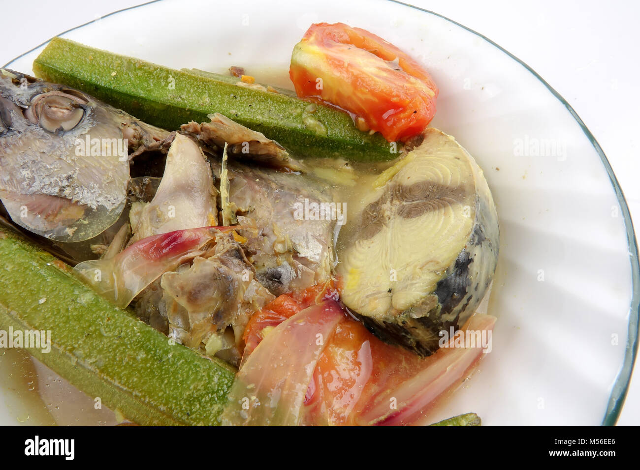 Thai Food of Tom Yum sea fish,tuna spicy soup in bowl on white ...