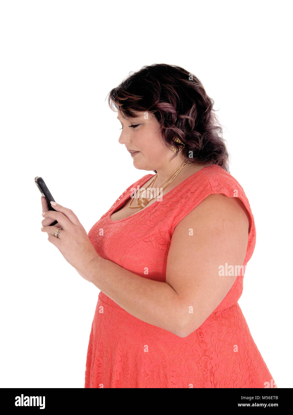 Oversized woman dealing on her cell phone Stock Photo - Alamy