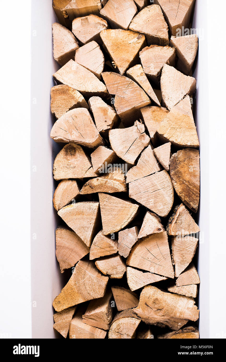 Stack of logs for wood burning stove Stock Photo - Alamy