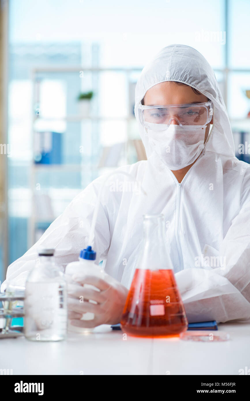Chemist working in the laboratory with hazardous chemicals Stock Photo ...