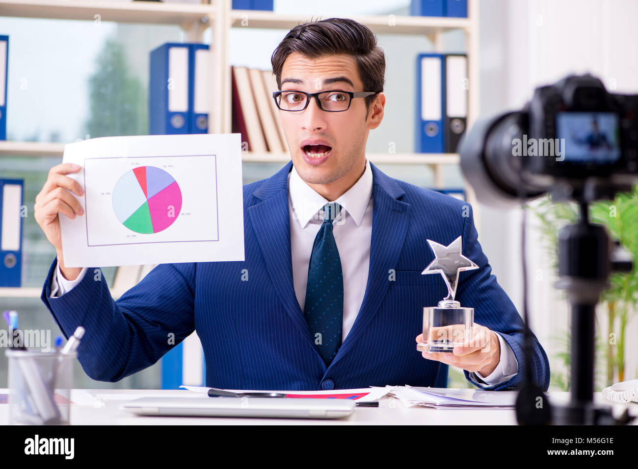Businessman recording a video for vlog Stock Photo - Alamy
