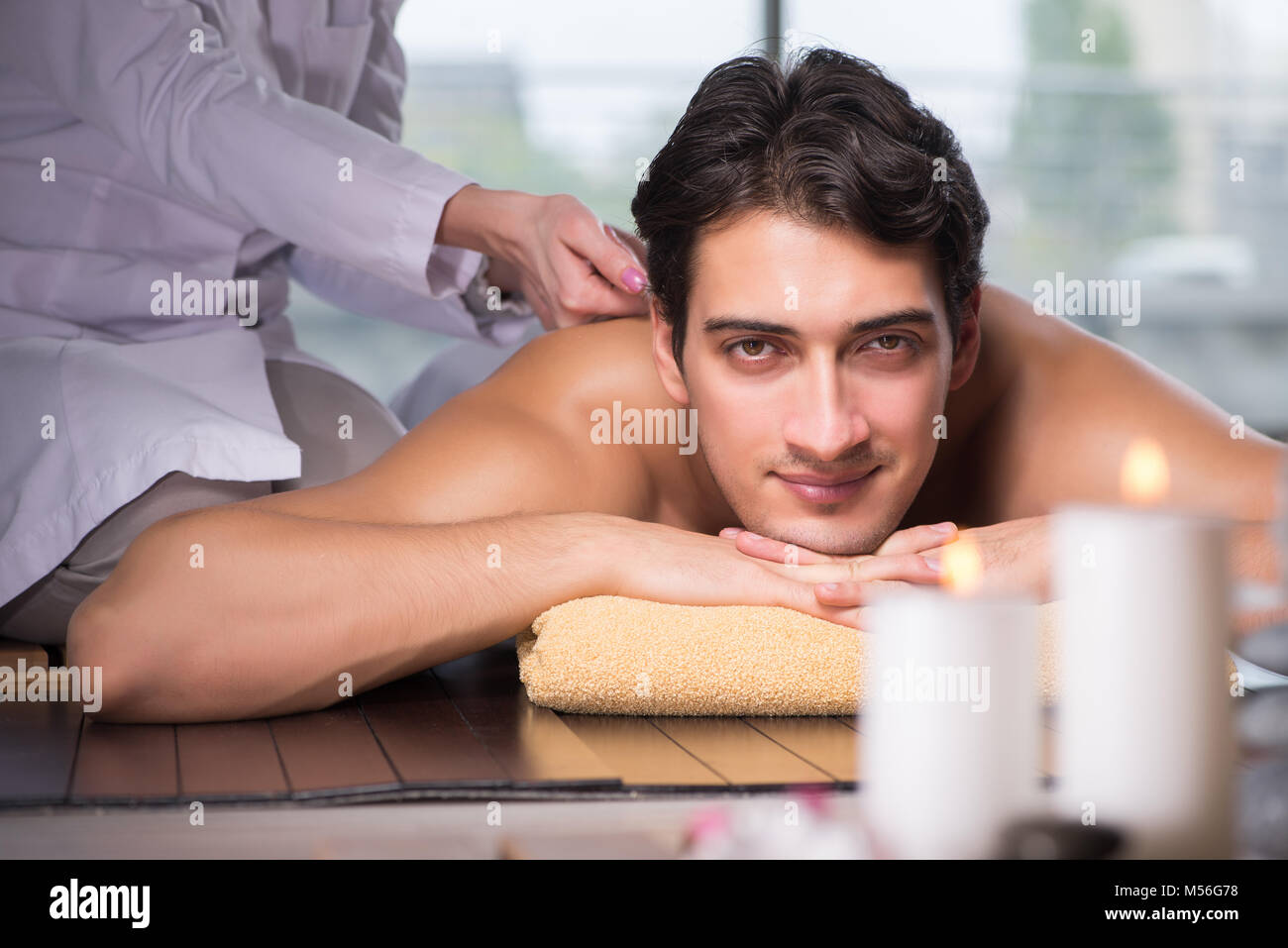 Young handsome man during spa procedure Stock Photo - Alamy