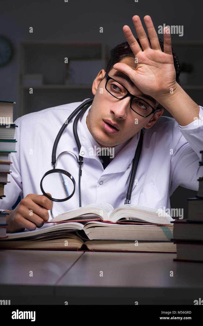 Medical student preparing for university exams at night Stock Photo - Alamy