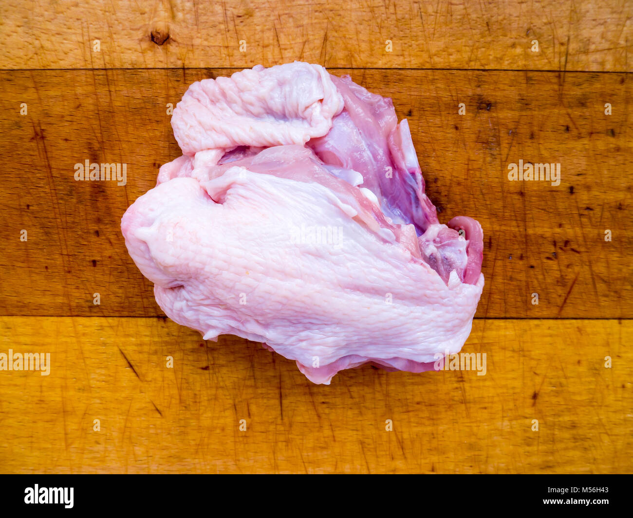 The Frozen chicken on a wood background Stock Photo - Alamy