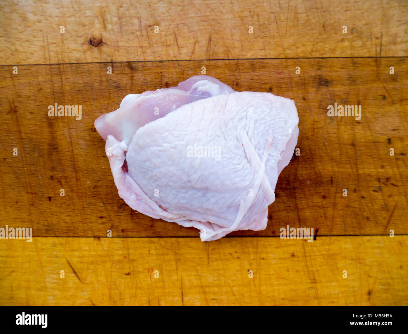 The Frozen chicken on a wood background Stock Photo - Alamy