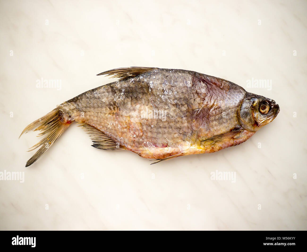 The Dried Fish Bream on a color background Stock Photo - Alamy