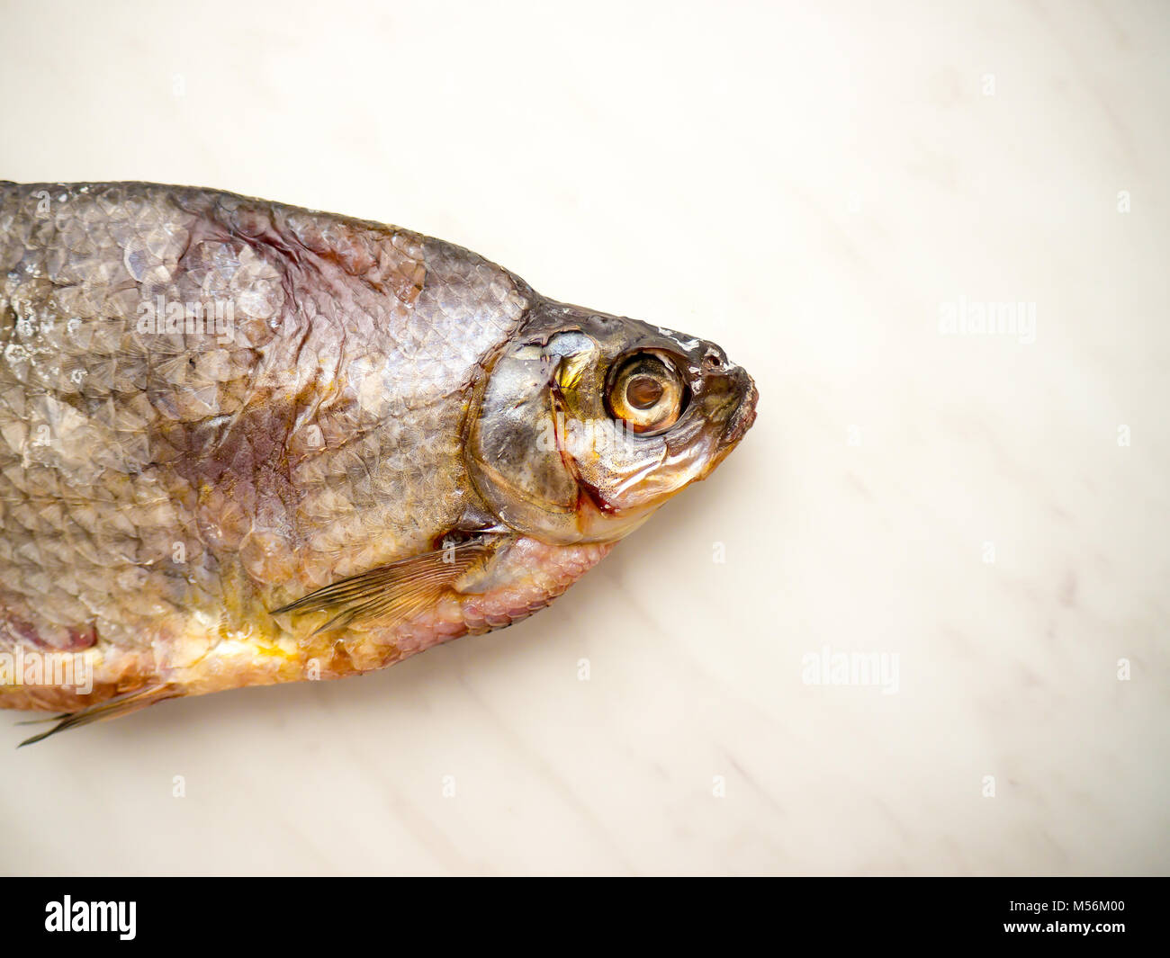 The Dried Fish Bream on a color background Stock Photo - Alamy