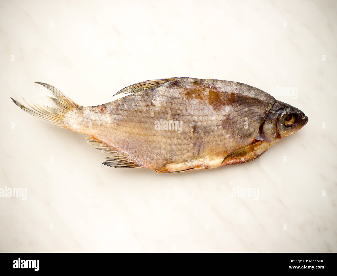 The Dried Fish Bream on a color background Stock Photo - Alamy